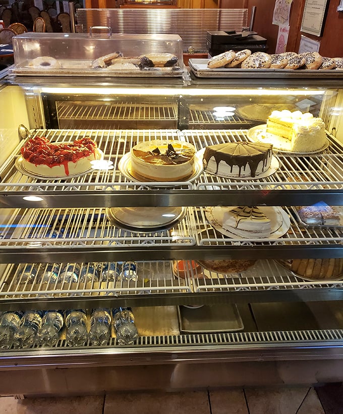 The dessert case—where willpower goes to die and "I'll just have coffee" turns into "and a slice of that chocolate cake, please."
