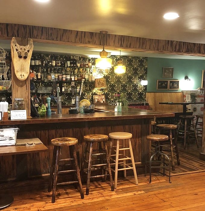 The bar area whispers, "Stay awhile," with wooden stools that have heard countless stories and probably a few marriage proposals.