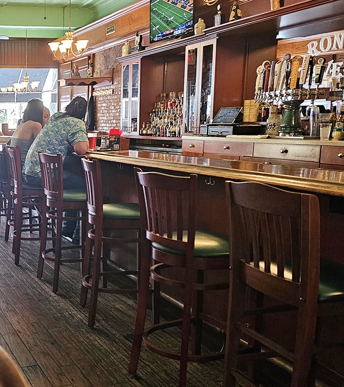 The bar area balances nostalgia with modern comforts. Those taps aren't just serving drinks—they're pouring community, one pint at a time.