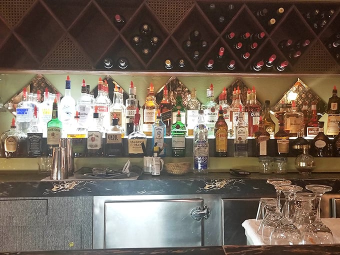 The bar doesn't need mixologists or craft cocktails—just honest pours to complement honest food in a space that encourages lingering conversations.