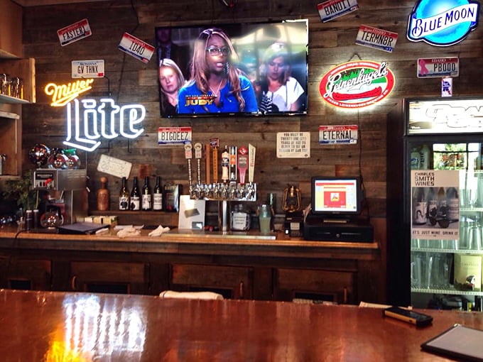 The bar area, where cold beer flows freely to extinguish the pleasant heat of spicy BBQ sauce—a necessary service in the pursuit of flavor. 