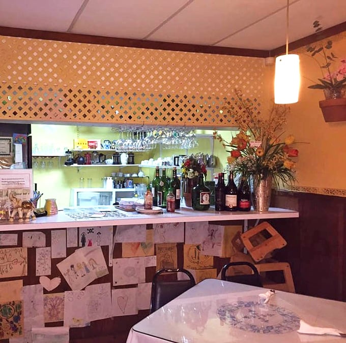 The lattice divider and warm lighting create distinct dining zones – perfect for both first dates and twentieth anniversaries.