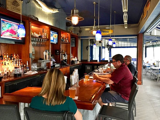 Casual elegance defines the bar experience at Kyma, where locals gather to debate important matters like "butter or cocktail sauce first?"