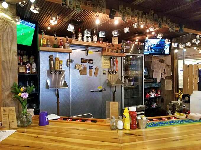 The bar's wooden countertop has probably heard more Kansas stories than any therapist in the state. Those condiments aren't decorative—they're essential.