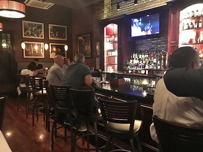 The bar area—where strangers become friends over perfectly mixed cocktails and shared appreciation for the game on screen.