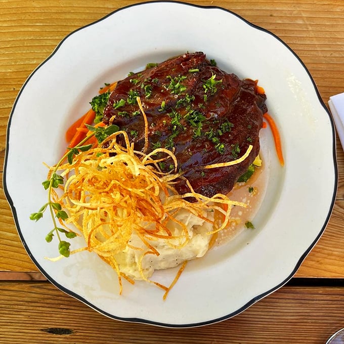 Brisket so tender it makes you wonder if they've discovered some secret law of physics. That crispy garnish adds textural counterpoint to meat symphony.