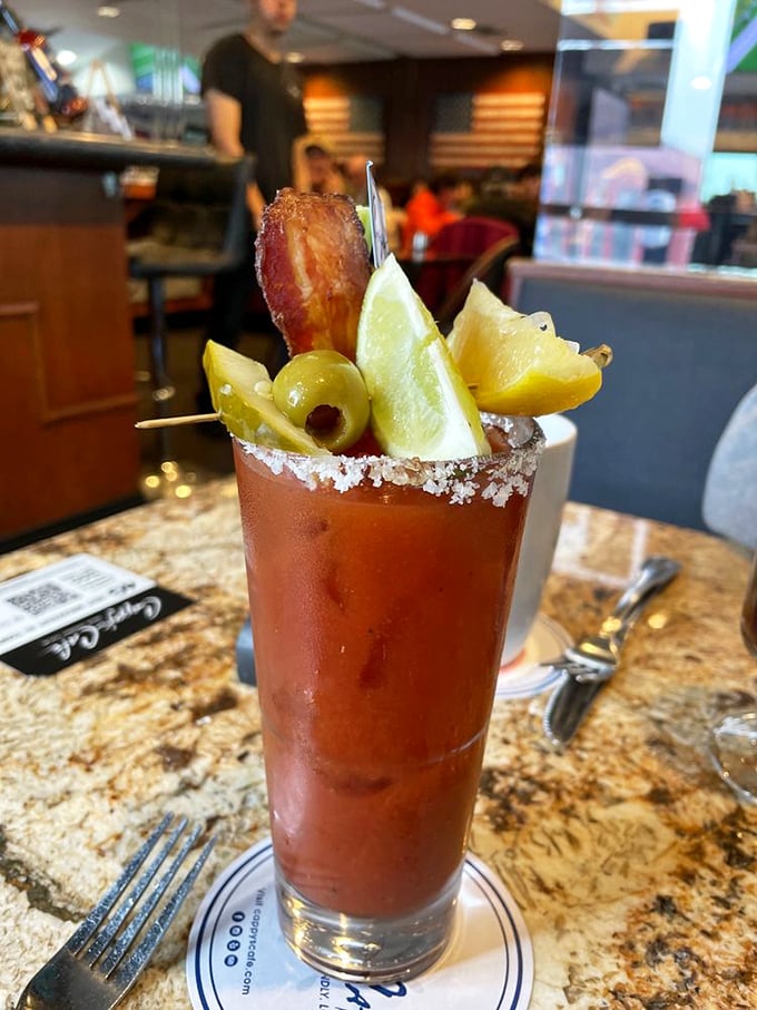 This isn't just a Bloody Mary—it's a meal in a glass, complete with bacon, olives, and enough garnish to count as a salad course.