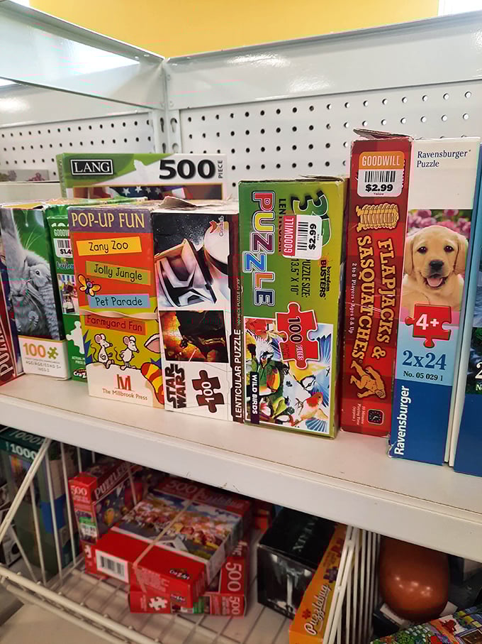 Board games and puzzles stack neatly on shelves, promising family game nights and rainy day entertainment for pocket change.