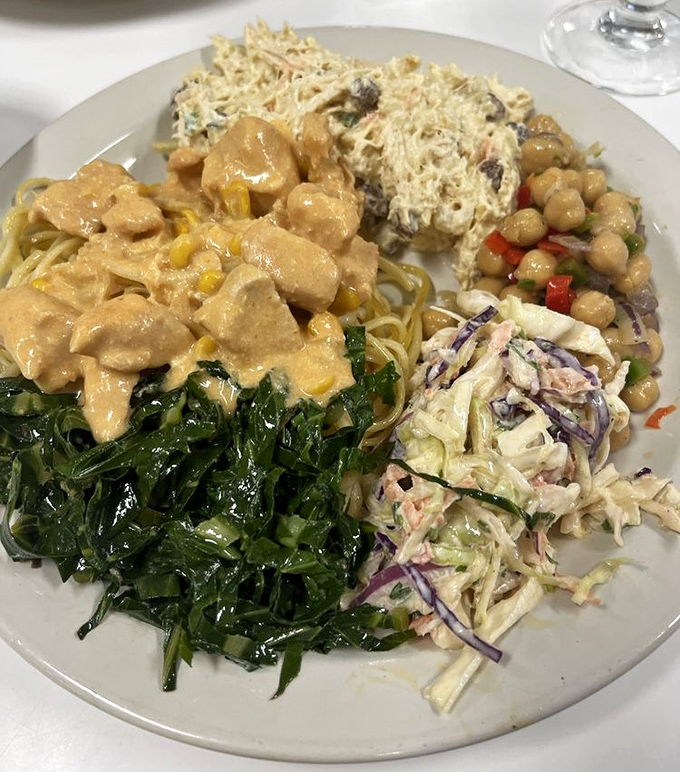 This isn't just a buffet plate—it's a strategic masterpiece of flavors, textures, and colors that would make a food stylist weep with joy.