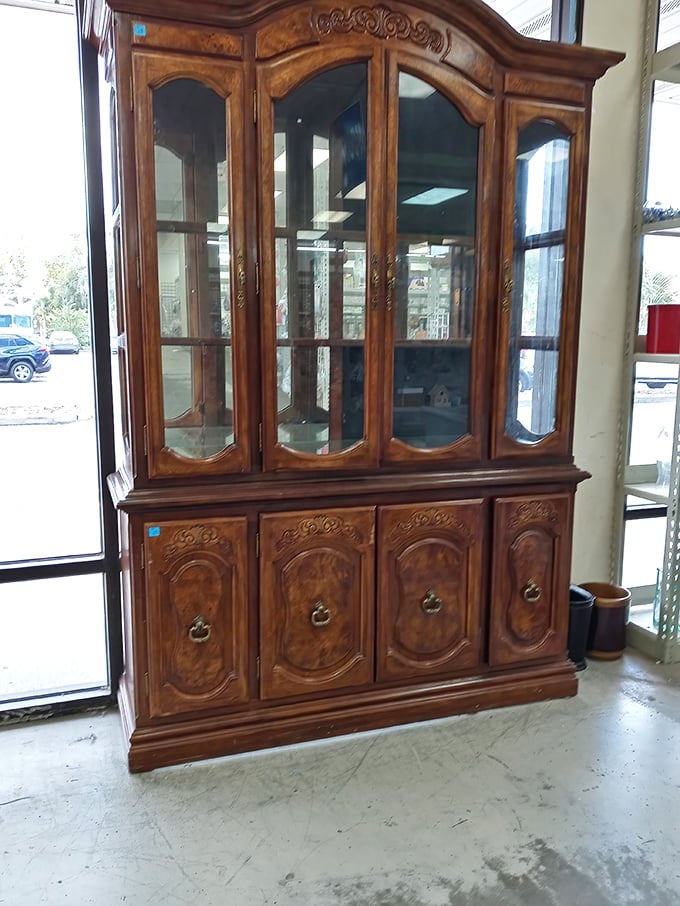 This ornate china cabinet has seen things—dinner parties, holiday gatherings, and now, it awaits a new family to impress.