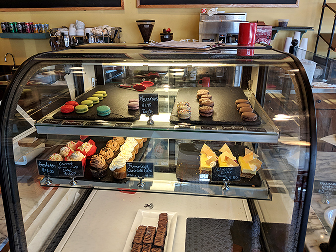 This display case isn't showing pastries—it's exhibiting edible art that makes museum paintings seem like a waste of wall space.