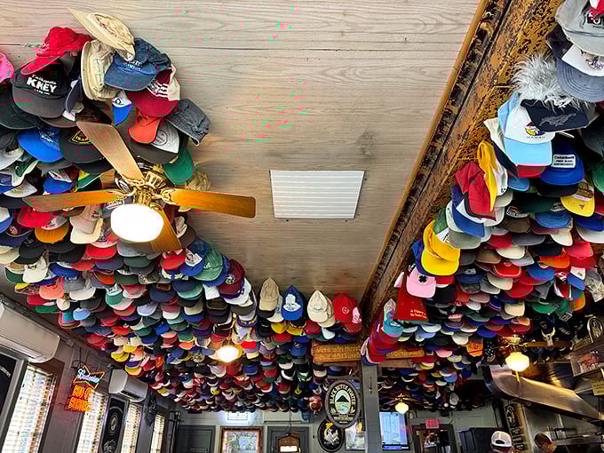 Looking up at the ceiling is like seeing a timeline of Oregon through its headwear. Each cap tells a story—some probably best left untold.