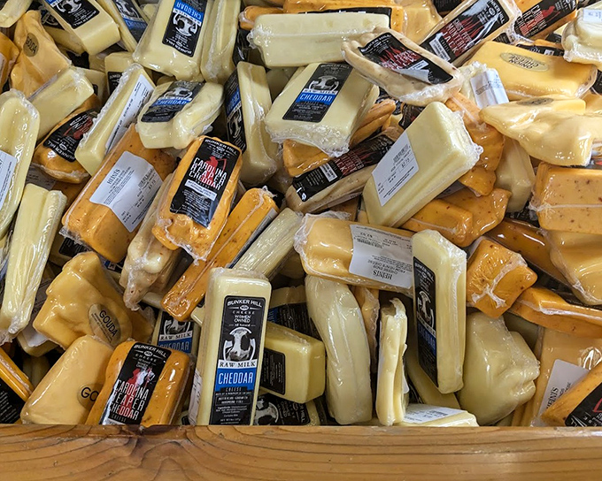 The cheese bin—where dairy dreams come true. These golden blocks contain more flavor than should legally fit in something this size.