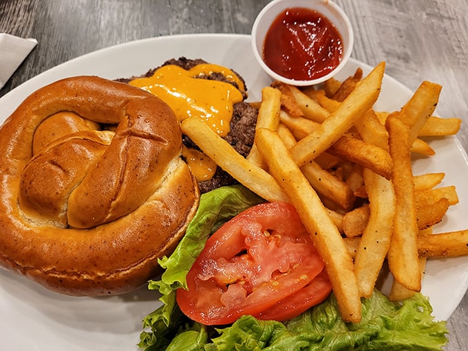 This isn't just a cheeseburger – it's a masterpiece of beef, cheese, and pretzel bun architecture that demands to be photographed before eaten.