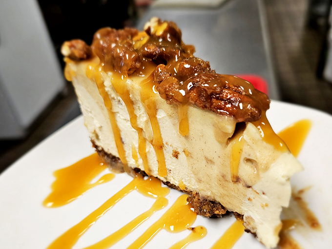 A slice of cheesecake that doesn't just end the meal—it provides the grand finale with caramel drizzle playing the part of fireworks.