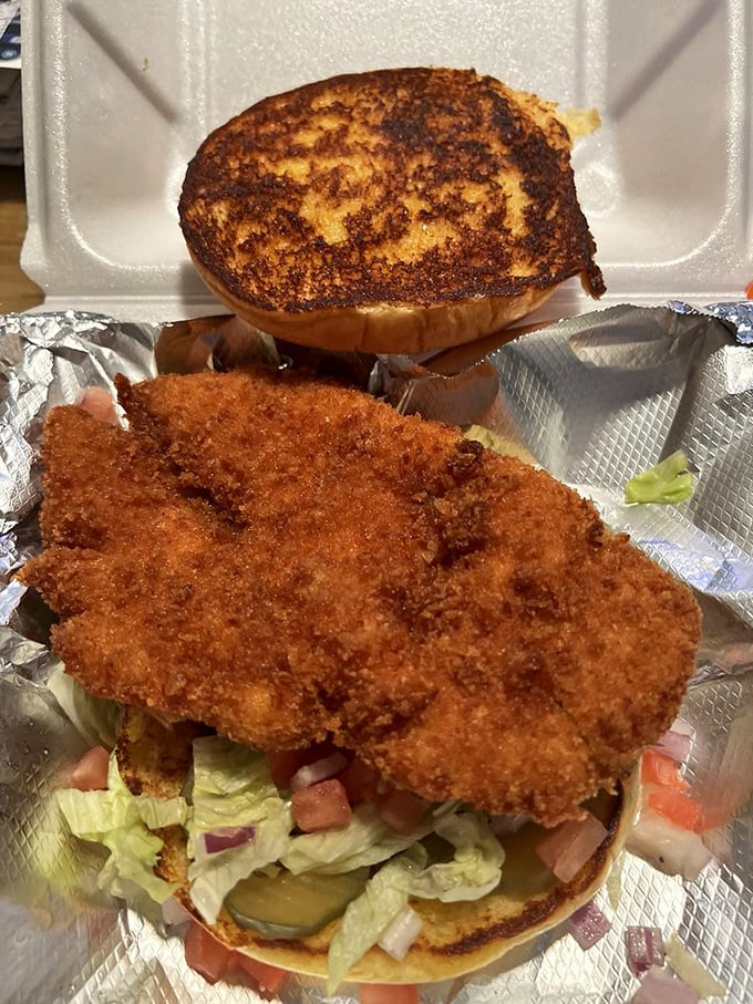 This chicken sandwich isn't just crispy—it's audibly crunchy from three tables away, nestled between golden buns like royalty on a throne.
