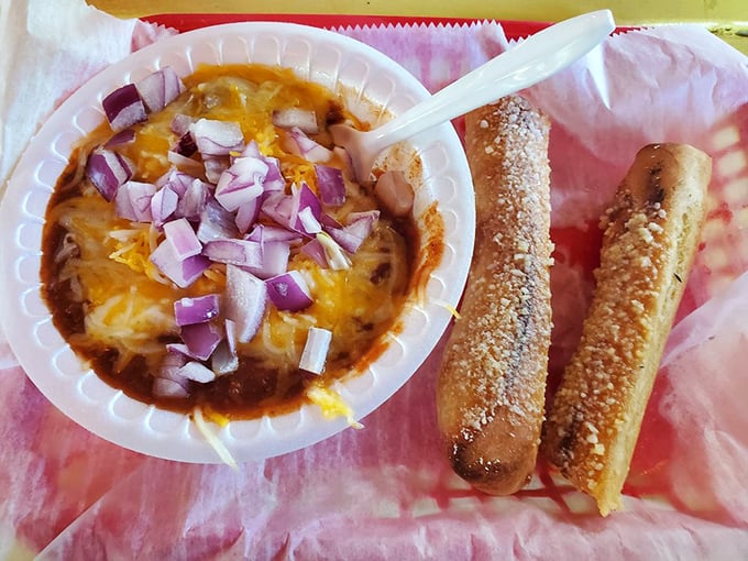 Chili so hearty it needs those red onions just to lighten the mood, with breadsticks standing by for essential dipping operations.