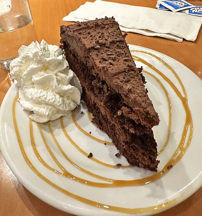 A slice of chocolate cake that doesn't need fireworks or sparklers—it lets its deep, rich decadence do all the talking.