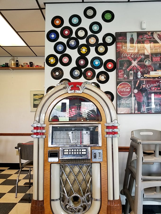 That jukebox isn't decorative—it's a time portal surrounded by vinyl records. Each selection offers a soundtrack to your meal from decades past.