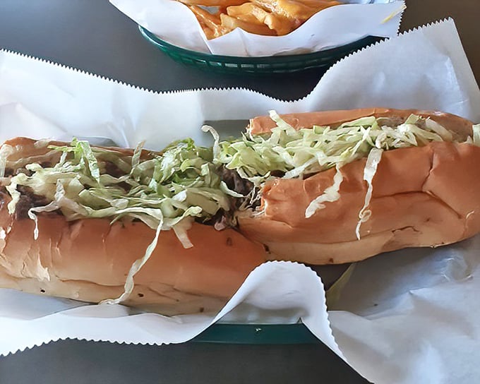 This isn't just a sandwich – it's a structural engineering marvel that somehow maintains integrity despite being loaded with deliciousness.