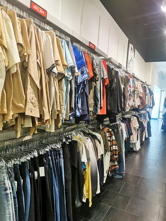 Racks on racks on racks—where 60% off signs transform "just browsing" into "I'll take three" faster than you can say "credit card."