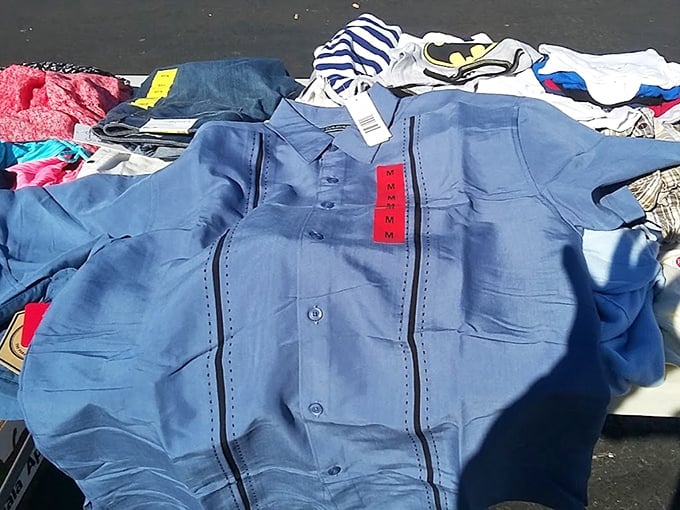 Brand new with tags—the holy grail of flea market clothing finds. This blue button-up is ready for its second chance at a first impression.