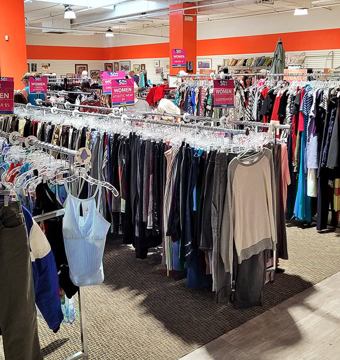 The clothing section's organized chaos reveals fashion treasures from every era – where yesterday's trends become tomorrow's statement pieces.