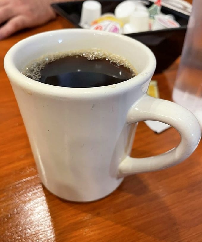 Simple, hot, strong coffee in a classic white mug—sometimes the best things don't need elaborate descriptions or foam art.
