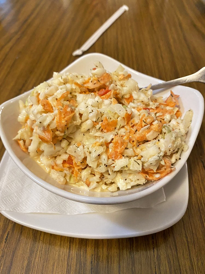 Coleslaw that didn't come from a plastic tub in the back of a refrigerated truck—creamy, crunchy proof that side dishes deserve respect too.