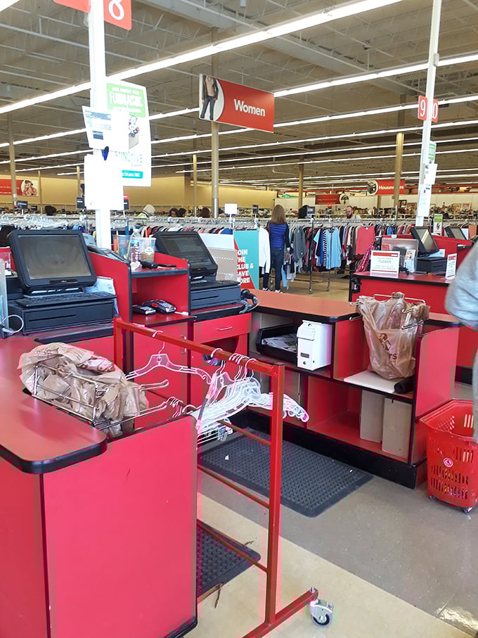 Where thrifting dreams meet checkout reality. The red counters have witnessed countless treasure hunters' victorious final moments.