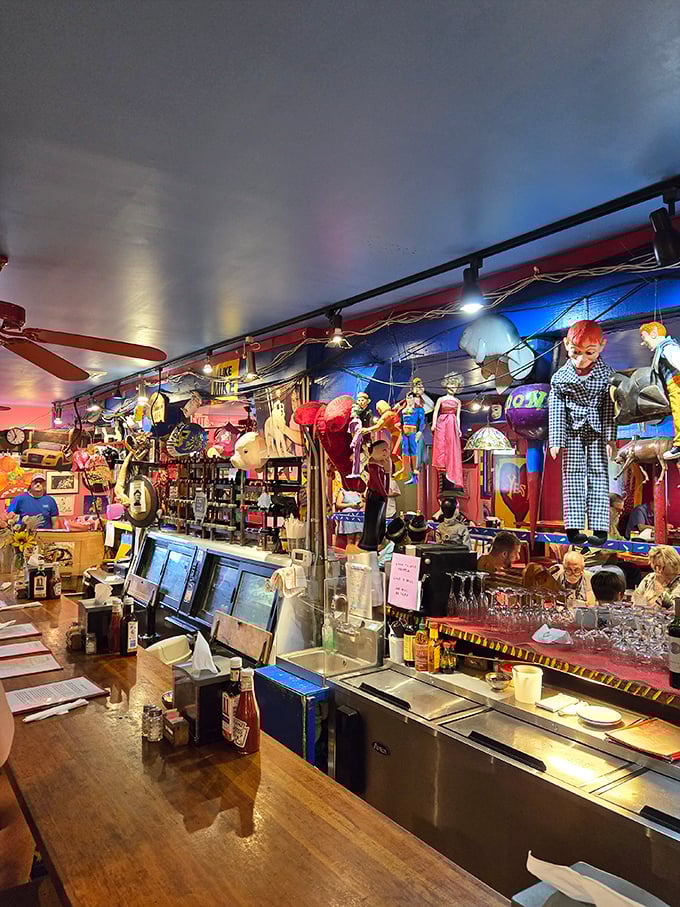 The bar at Cuz's isn't just stocked with spirits—it's populated with enough quirky decorations to keep you entertained between courses.