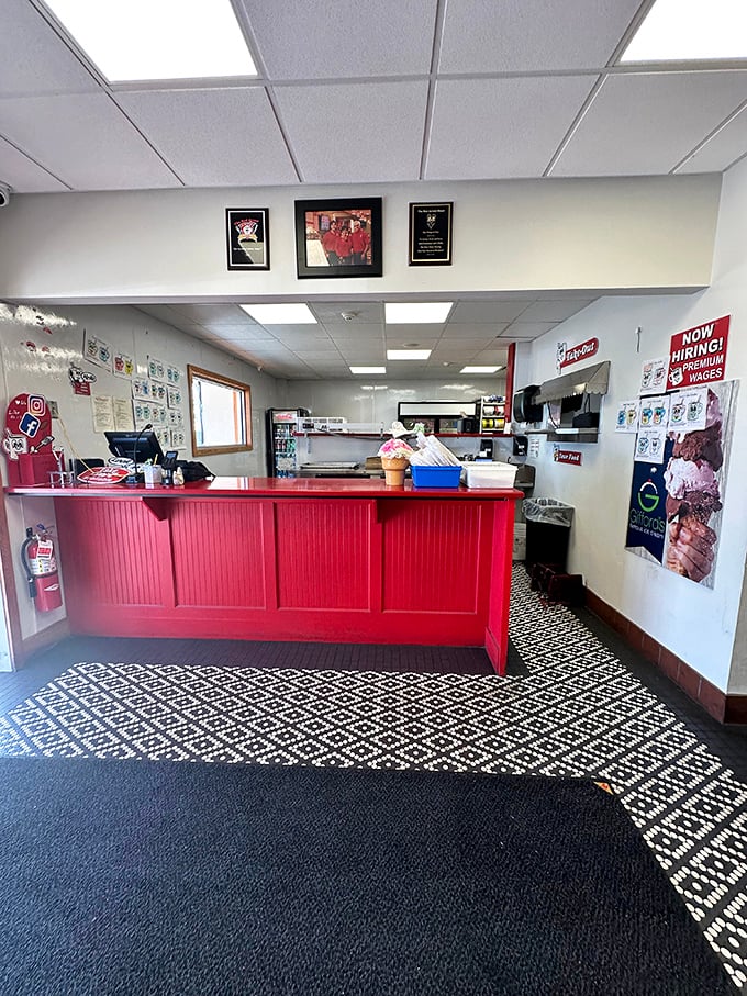 The entrance counter welcomes you with its cheerful red panels and promises of comfort food that will solve whatever ails you—or at least make you forget about it for a while.