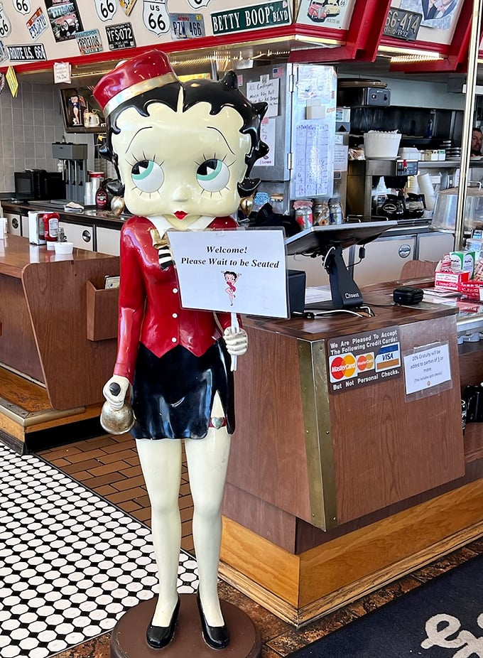 Greeted by Betty Boop herself – this life-sized hostess has been welcoming diners with the same plastic smile since Elvis was on the radio.