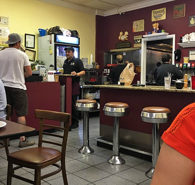 Classic diner counter seating—where solo diners become regulars and the staff eventually knows your order before you sit down.