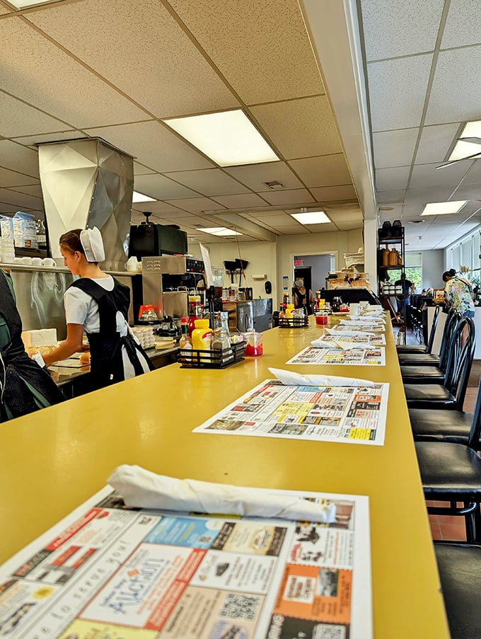The counter seating offers front-row views of small-town America – where newspapers still matter and conversations happen face-to-face rather than screen-to-screen.