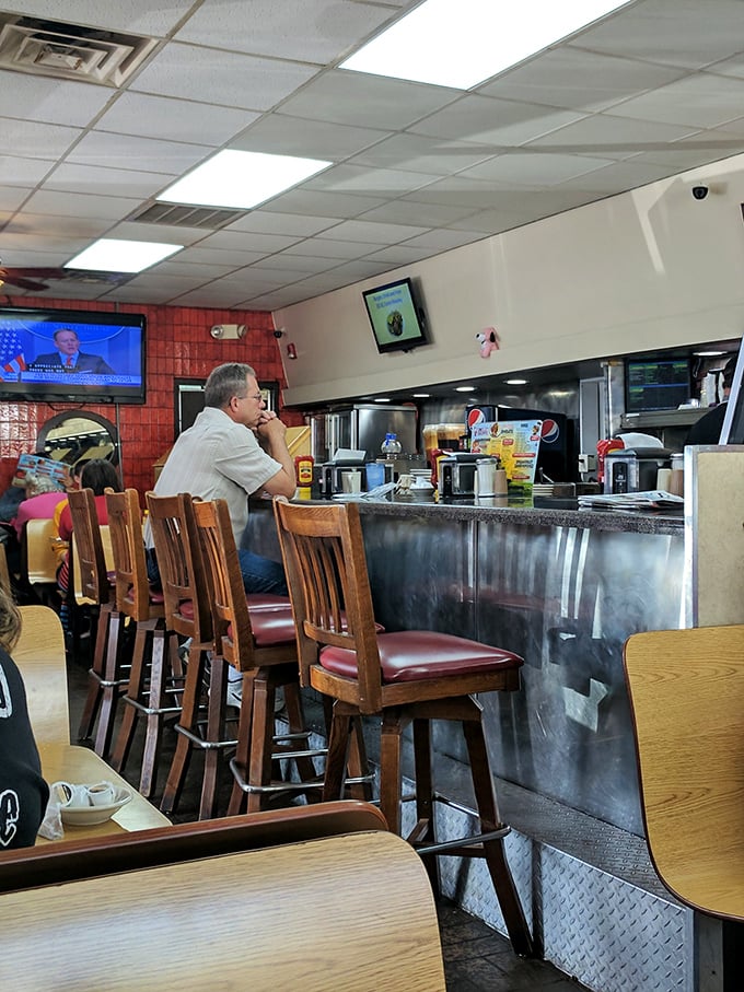 The counter seats—where solo diners become temporary members of the breakfast club and servers know exactly how you take your coffee.