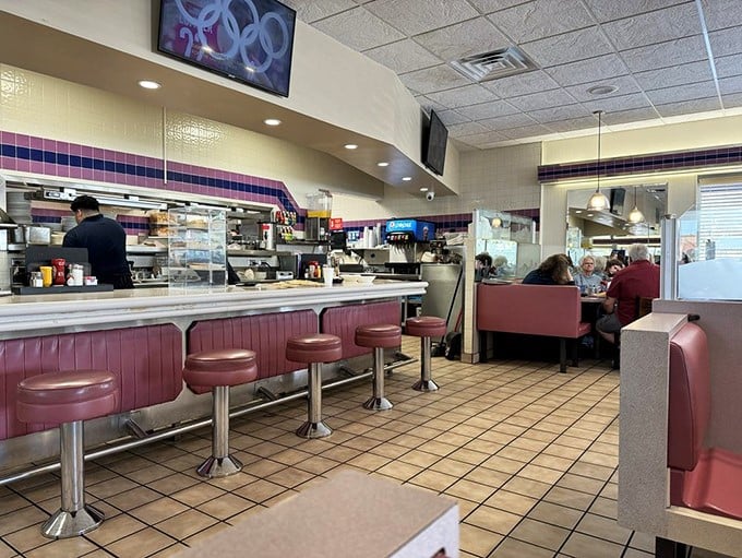 The classic diner counter—where solo diners find community and everyone gets a front-row seat to the breakfast ballet.
