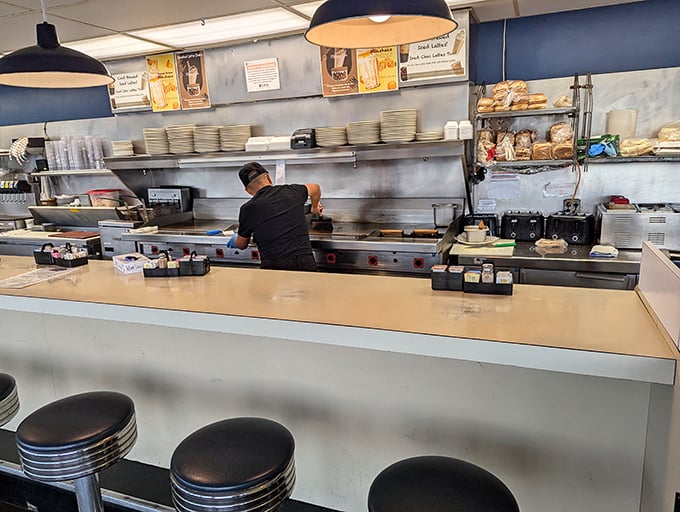 The grill—where breakfast dreams come true and the short-order cooks perform their morning symphony of sizzles and flips.