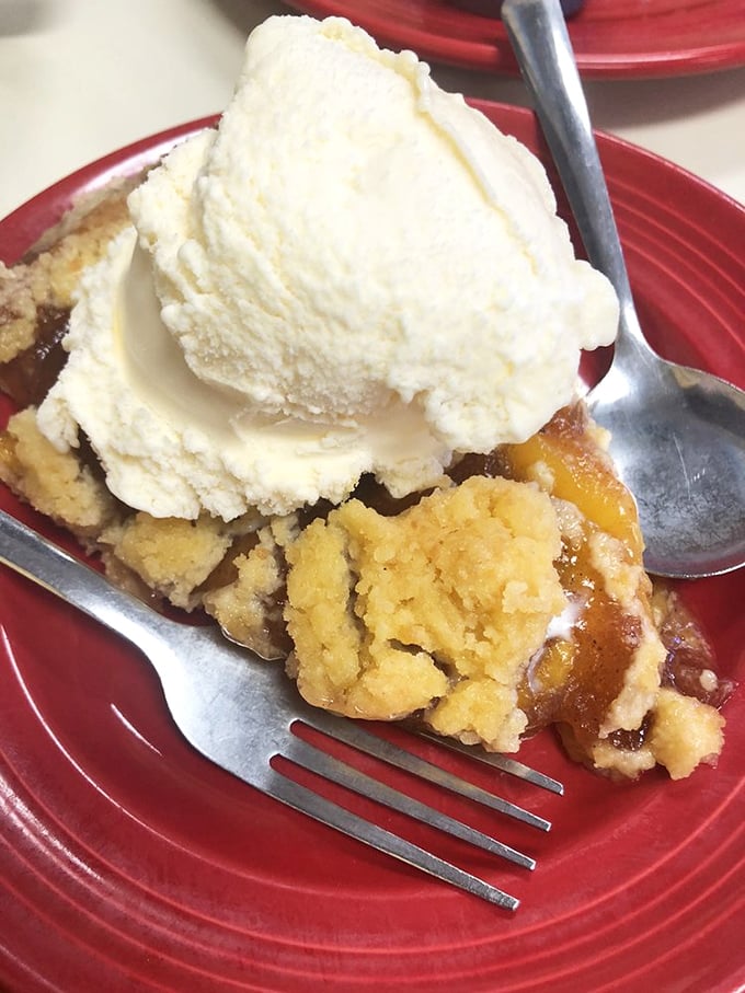 Peach pie à la mode—where warm, cinnamon-kissed fruit meets cold, creamy ice cream in a temperature tango that makes taste buds applaud.
