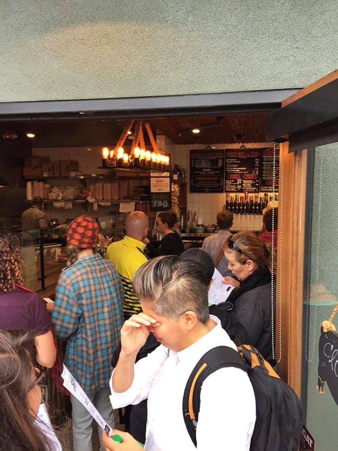 The line forms for a reason – these patient pilgrims know that good things come to those who wait for properly smoked meat.