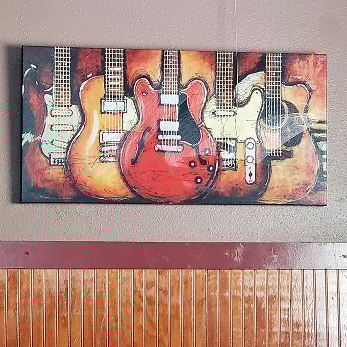 The guitar artwork on the wall isn't just decoration—it's foreshadowing the good times that happen when food, drinks, and music collide.