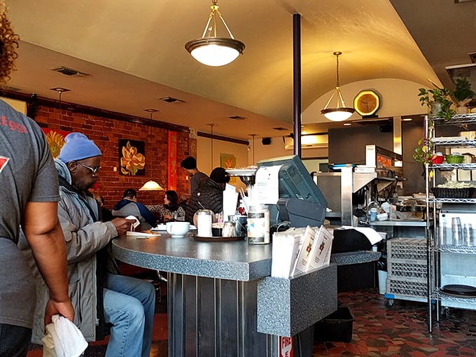 The counter seating – where strangers become temporary breakfast companions united by the universal language of "pass the hot sauce, please."