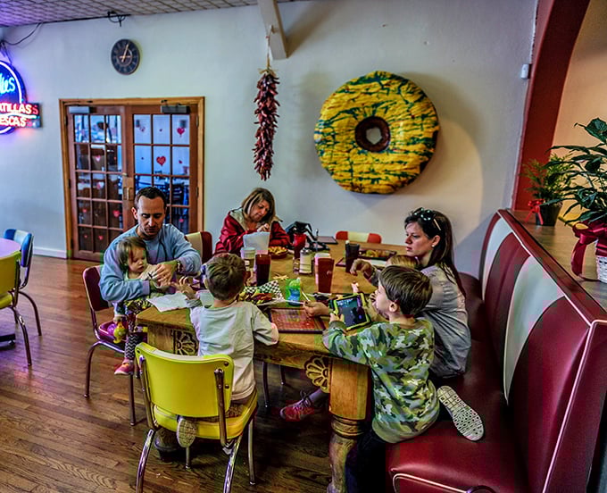 A family gathering around simple food and conversation – the timeless tableau that reminds us why diners like this matter more than fancy restaurants.