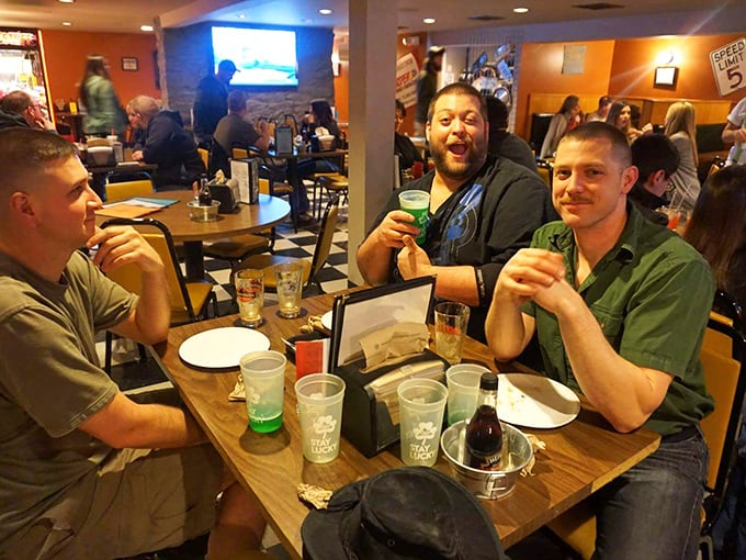 Nothing says "we found the good spot" like the genuine smiles of friends enjoying cold drinks and good company.