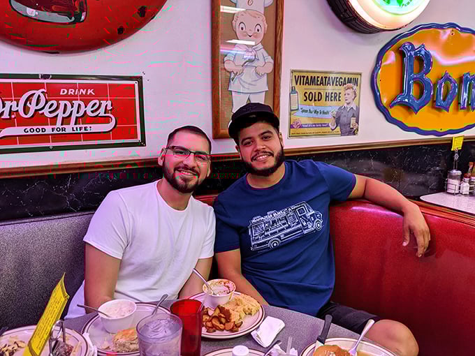 Two happy diners enjoying the fruits of Sherri's kitchen—their smiles say what words can't: "You should be eating this right now."