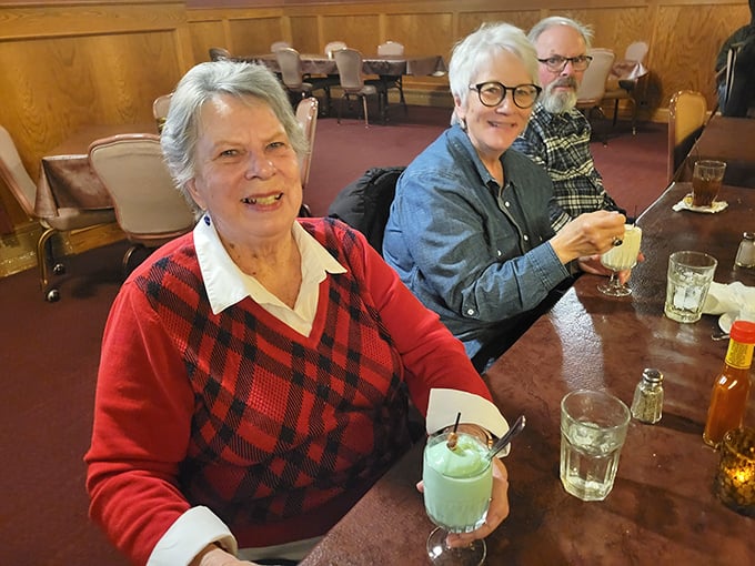 The true measure of any restaurant: happy diners raising glasses in celebration. Those smiles aren't just expressions—they're testimonials without words.