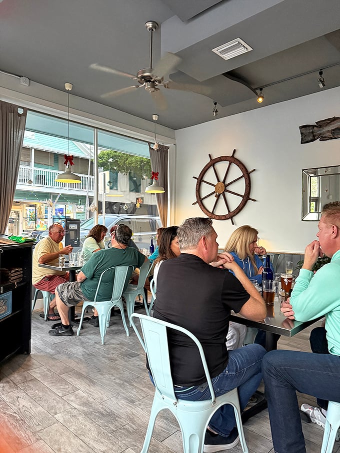 Happy diners lost in conversation and seafood bliss—the universal language of "this is so good I forgot what I was saying."