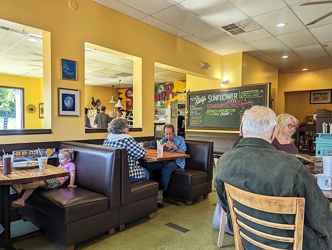 Where regulars become family—cozy booths and cheerful yellow walls create the perfect backdrop for morning rituals and maple syrup-soaked conversations.