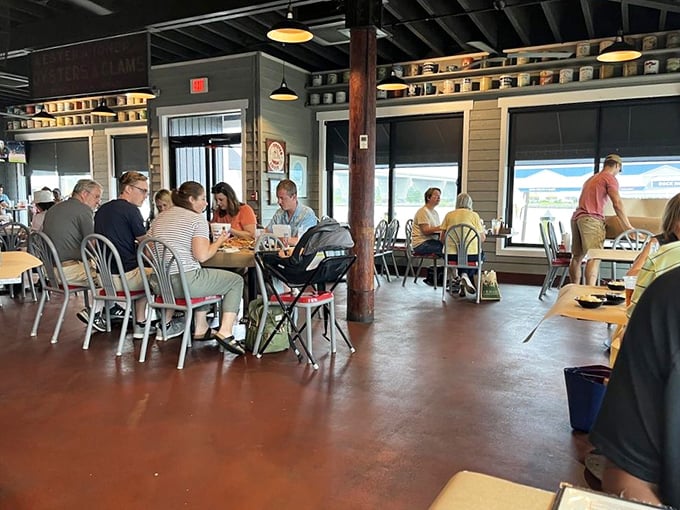 The dining room hums with the universal language of seafood enjoyment. Notice how nobody's looking at their phones—crab picking requires full attention and both hands.