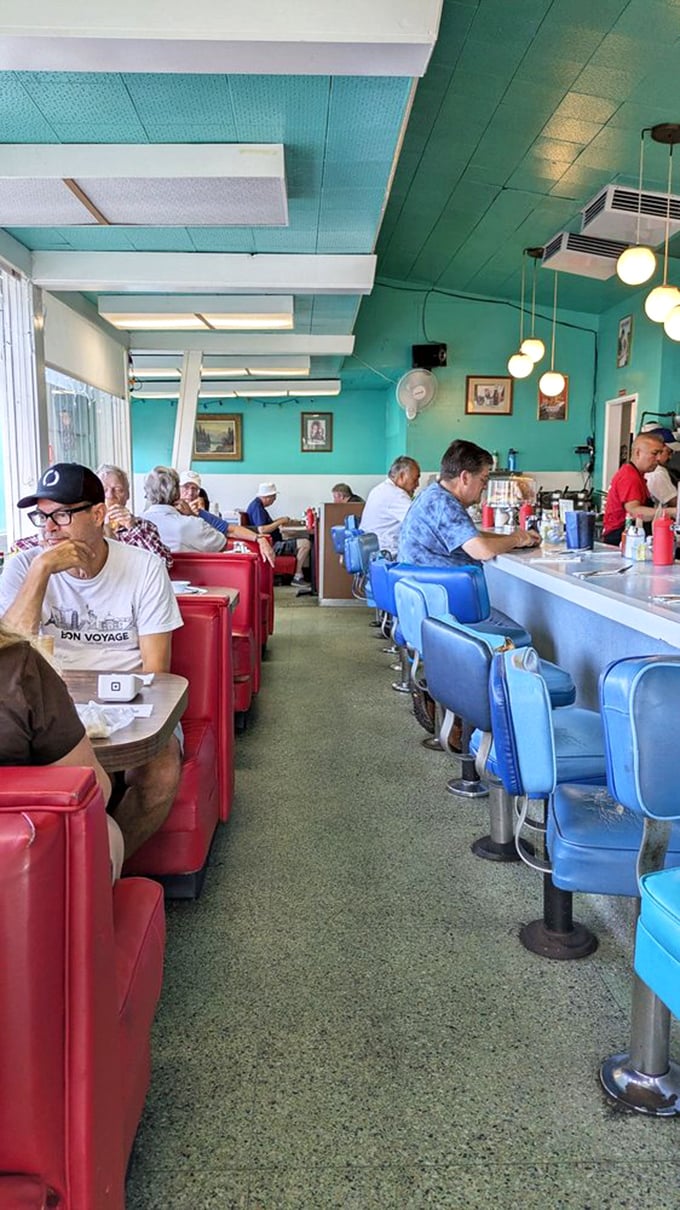 The morning crowd knows the secret—arrive early, bring your newspaper, and settle in for breakfast that makes fancy brunch spots obsolete.